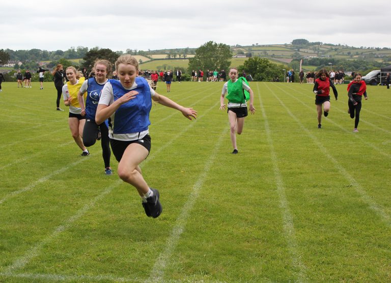 Maddison Wilson dives for the line to take the win - Banbridge Academy