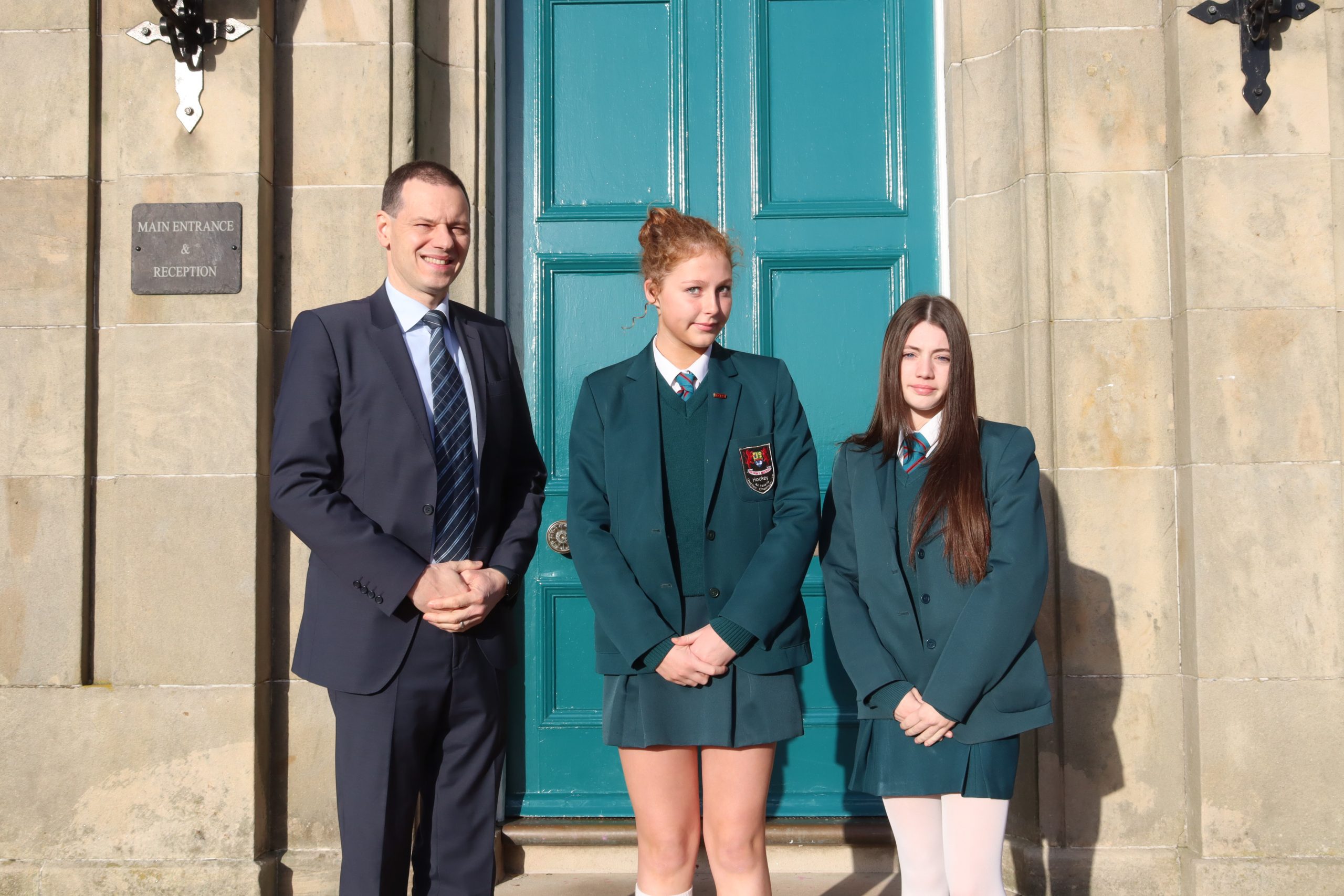 Principal Robin McLoughlin congratualtes Maisie and Talia on thier ...