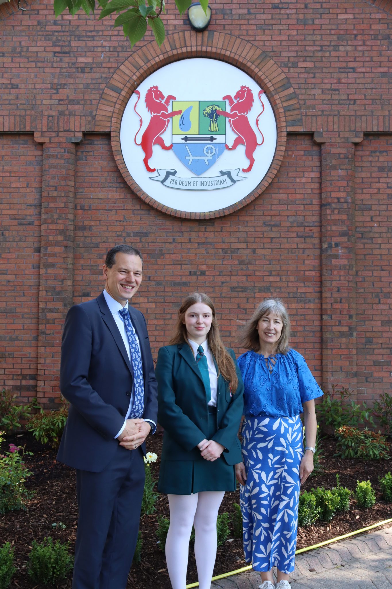 Prinicpal Robin McLoughlin and teacher Helen Adair congratulate Roisin ...